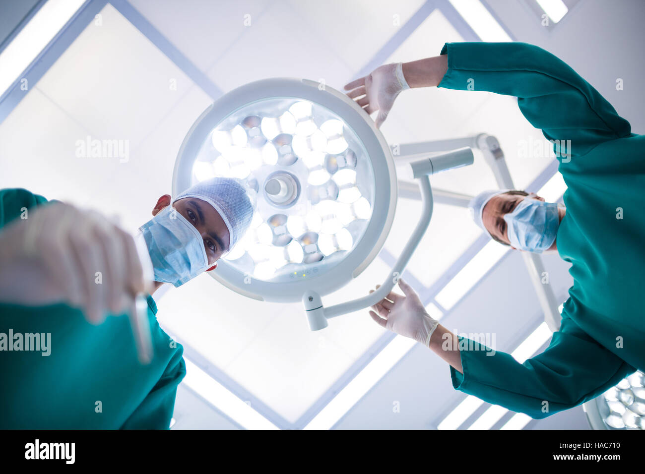 Surgeon adjusting his surgical gloves hi-res stock photography and ...