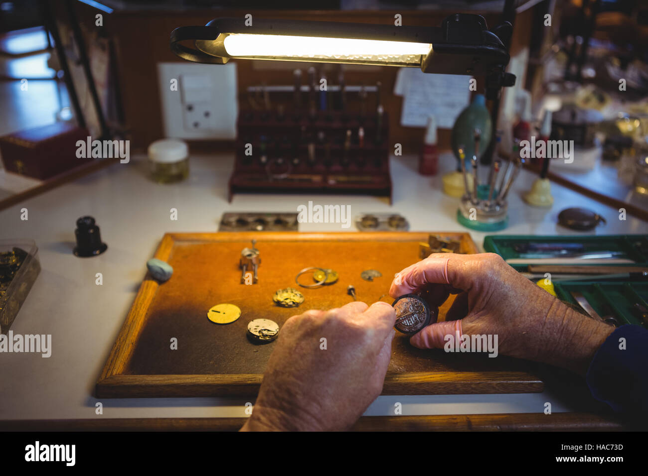 Horologist repairing a watch Stock Photo - Alamy