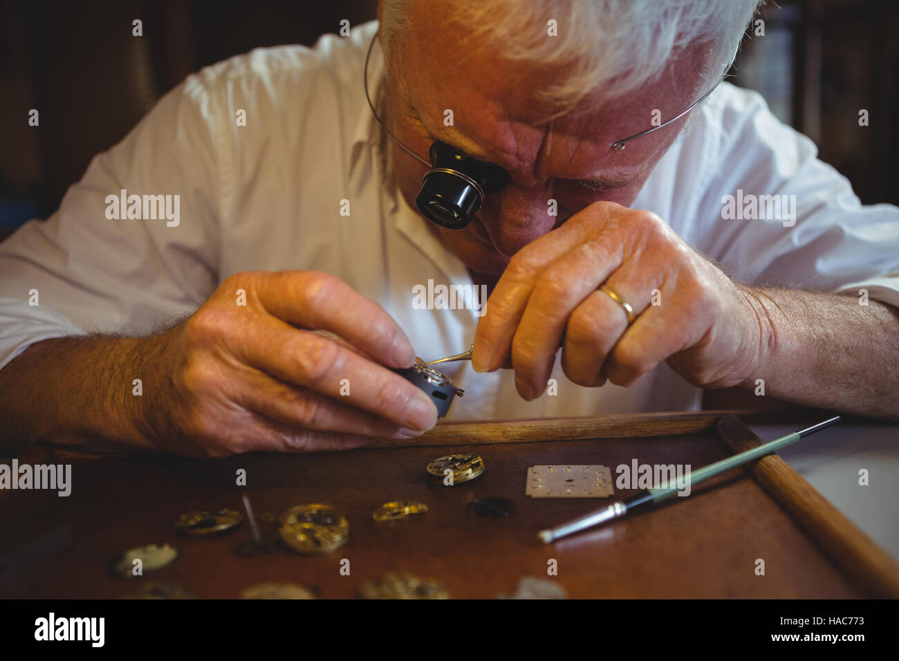 Horologist repairing a watch Stock Photo - Alamy