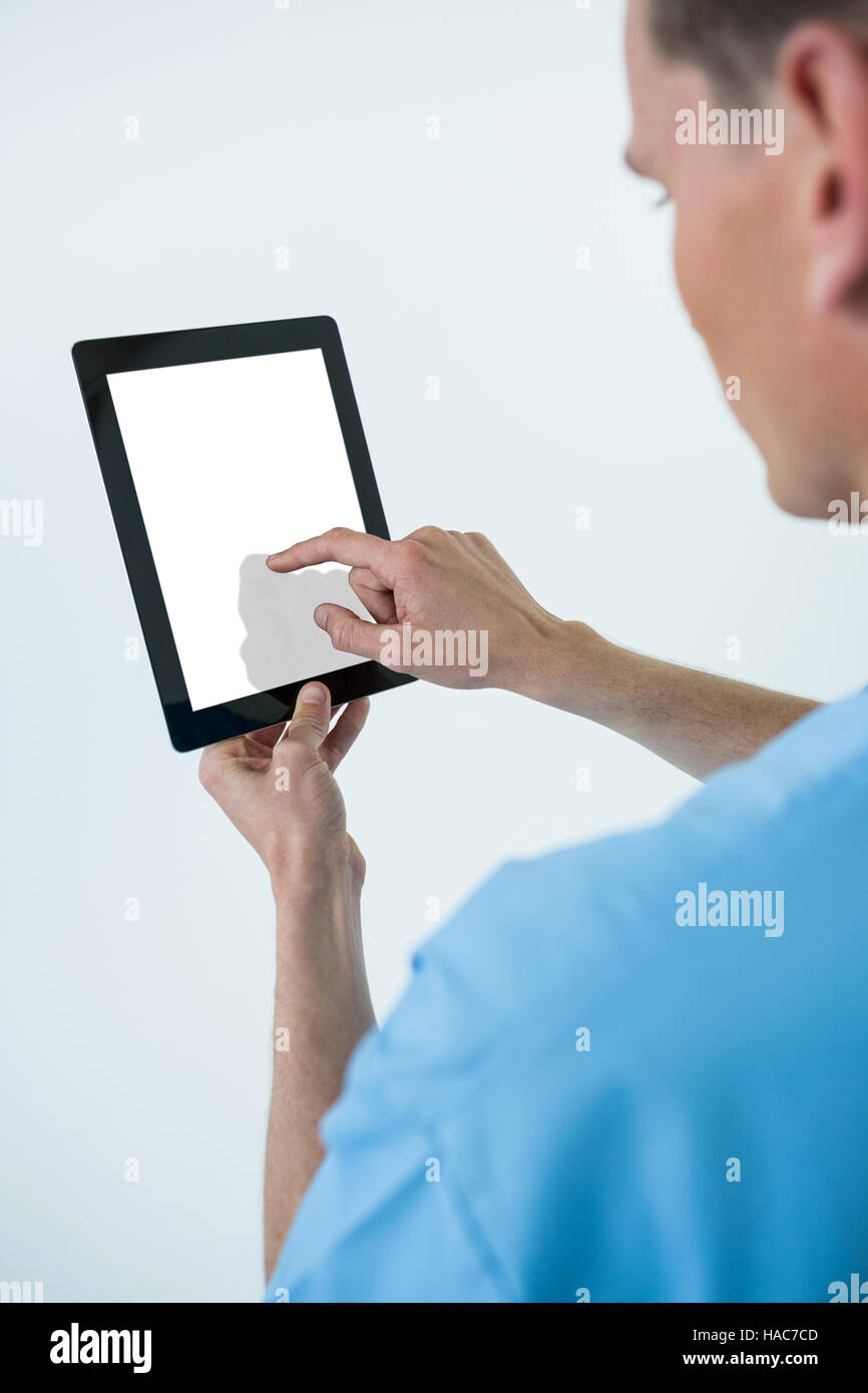 Male nurse using digital tablet Stock Photo - Alamy