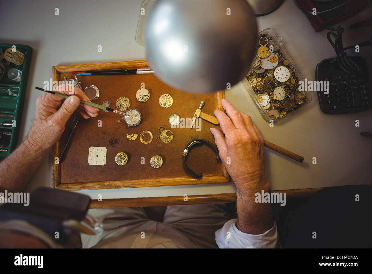Horologist repairing a watch Stock Photo - Alamy