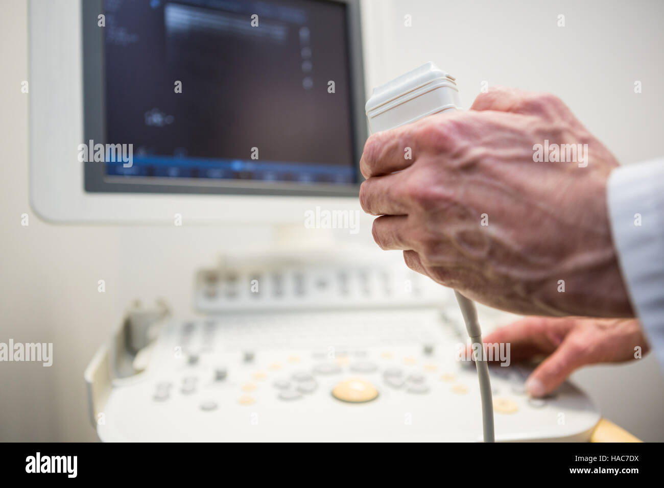 Doctors using sonography machine Stock Photo - Alamy