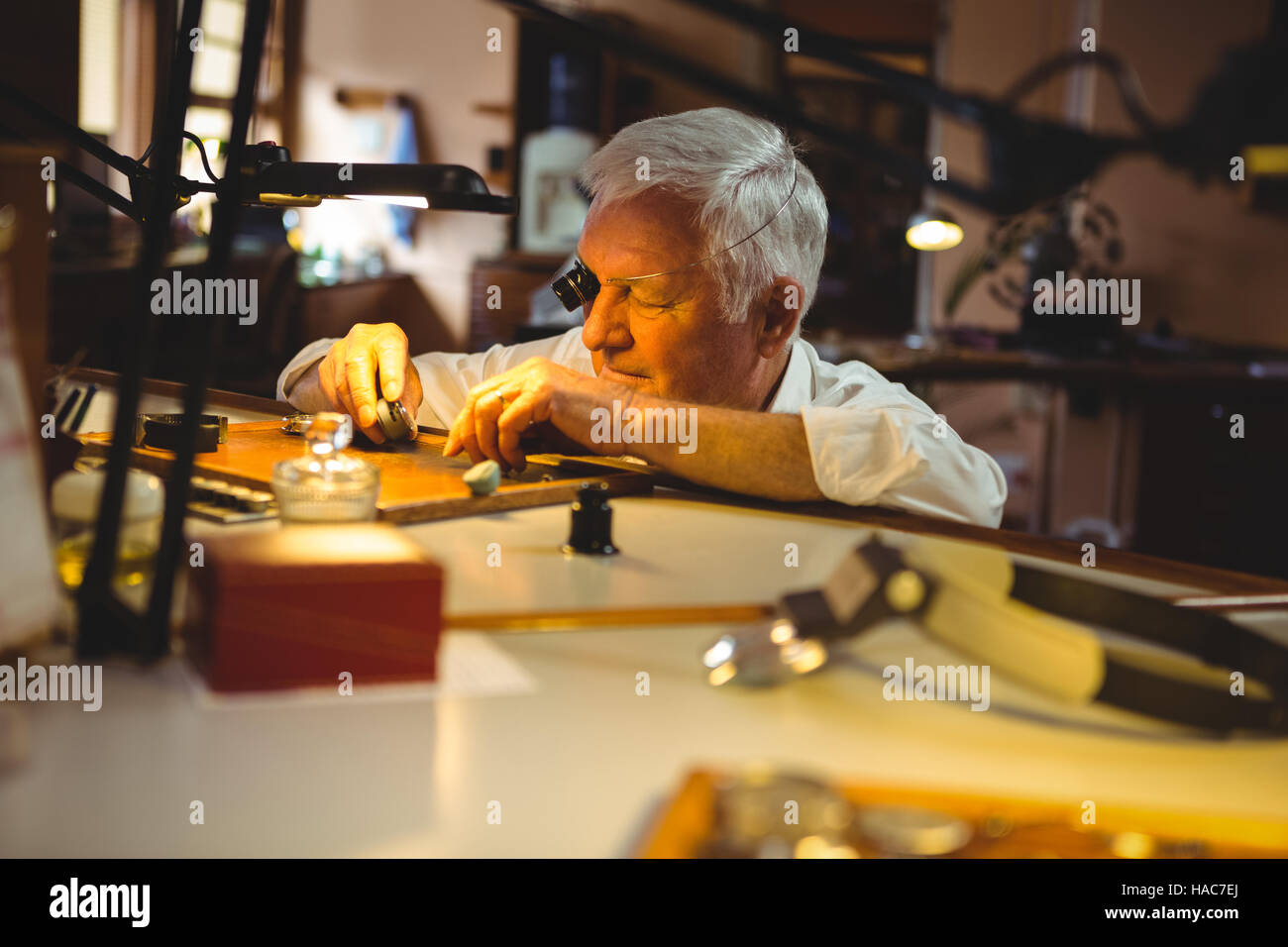 Horologist repairing a watch Stock Photo - Alamy