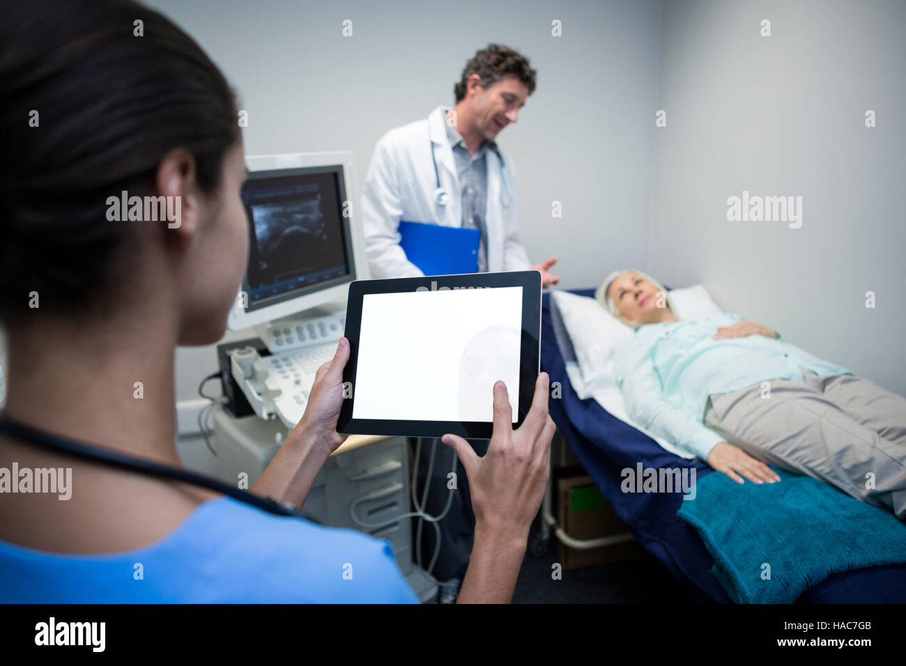 Doctor using digital tablet Stock Photo - Alamy