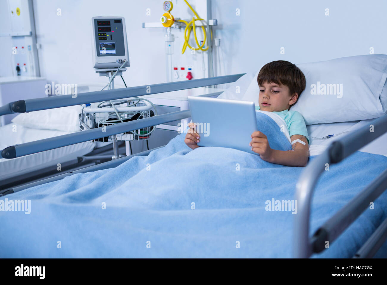 Patient using digital tablet in ward Stock Photo - Alamy