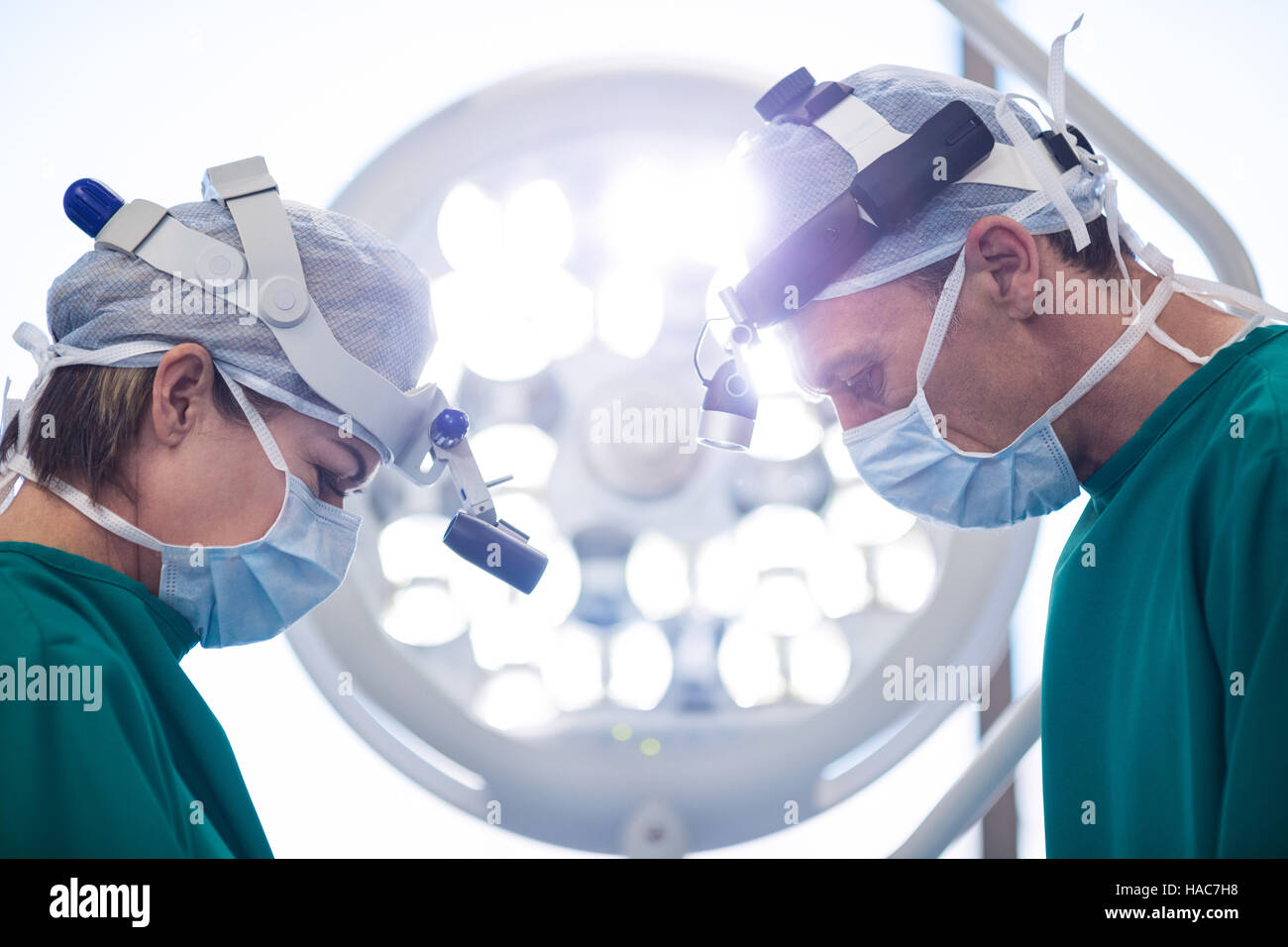 Surgeons performing operation in operation room Stock Photo - Alamy