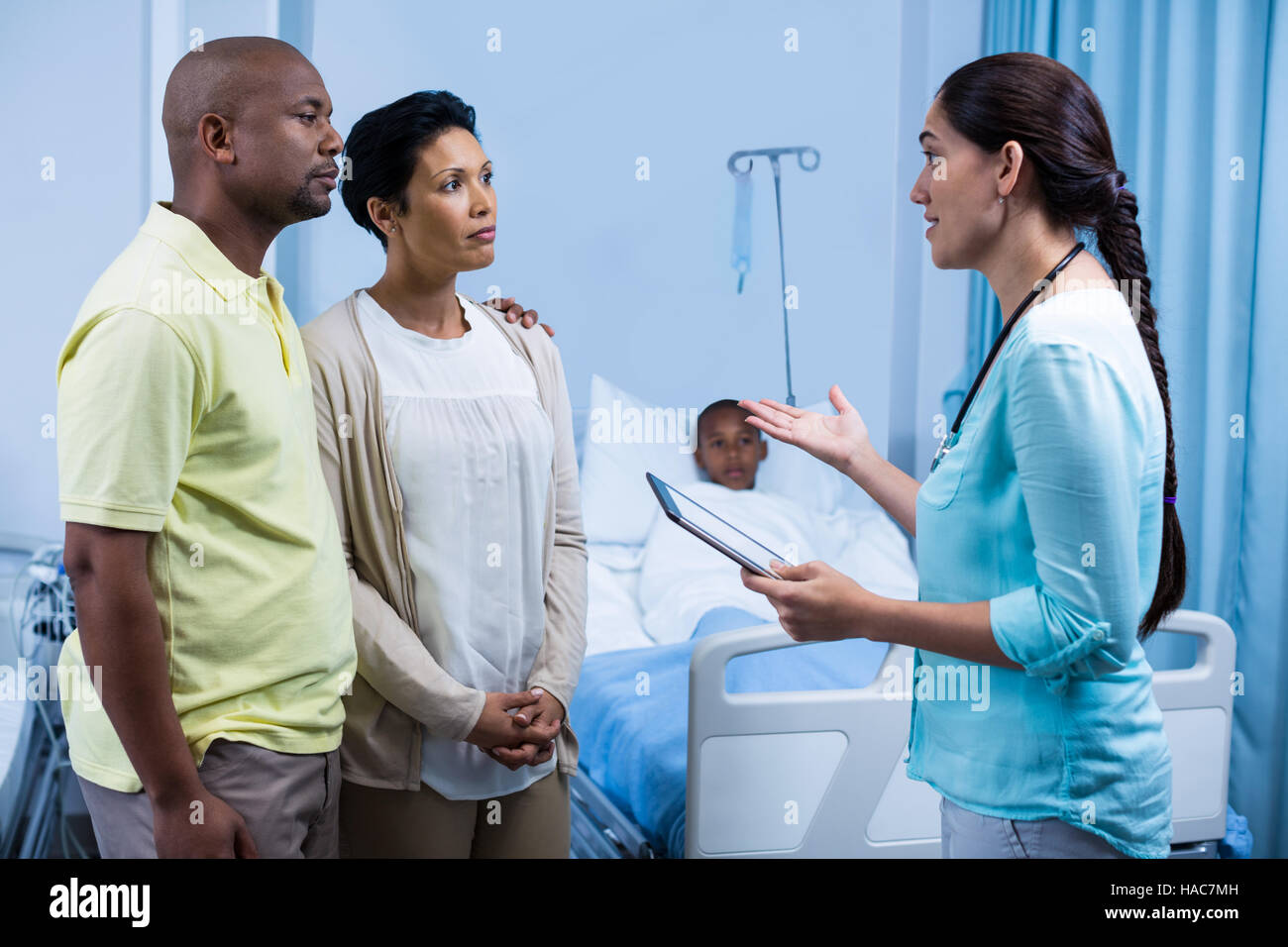 Doctor interacting with patient parents Stock Photo - Alamy