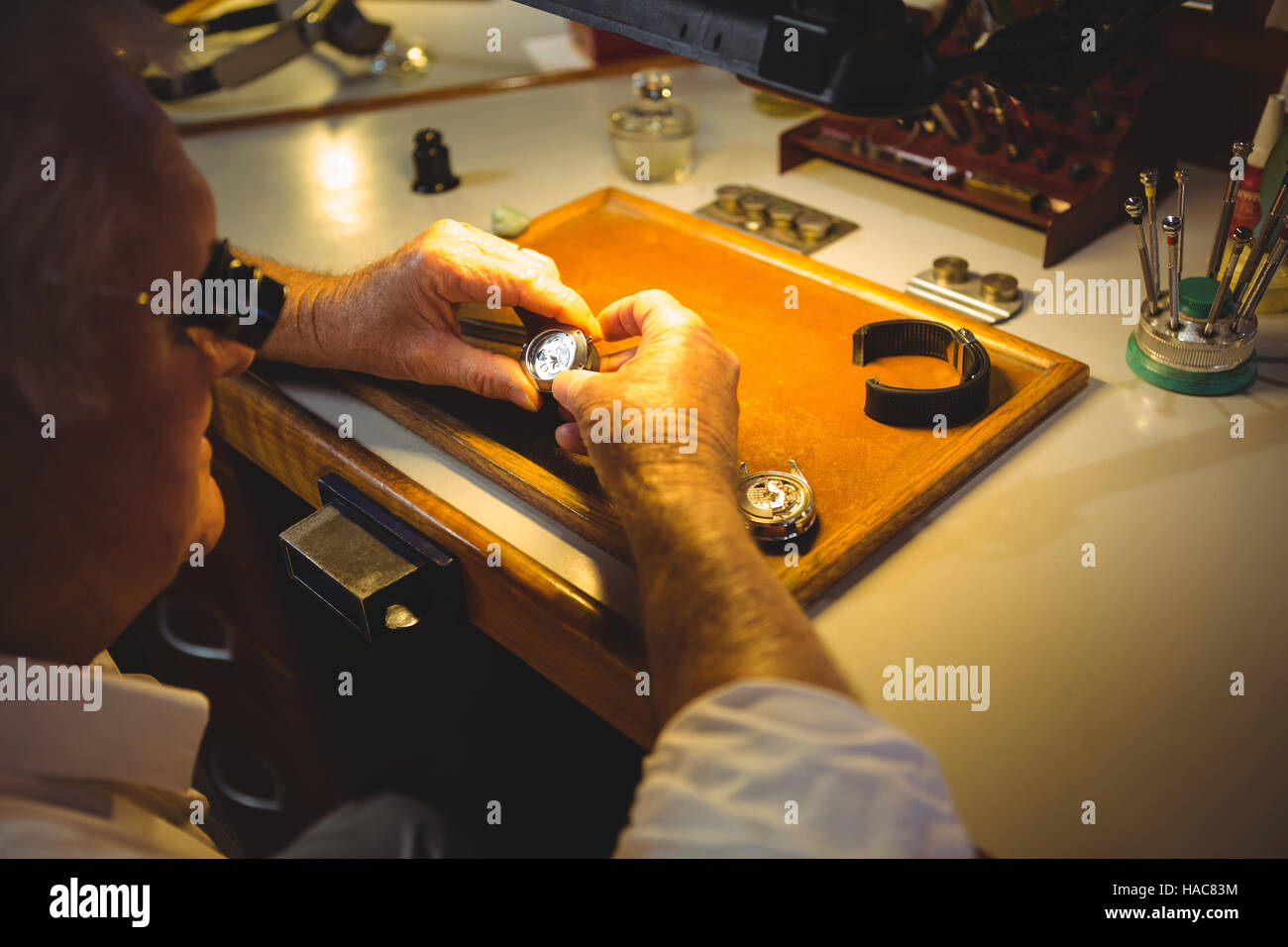 Horologist repairing a watch Stock Photo - Alamy