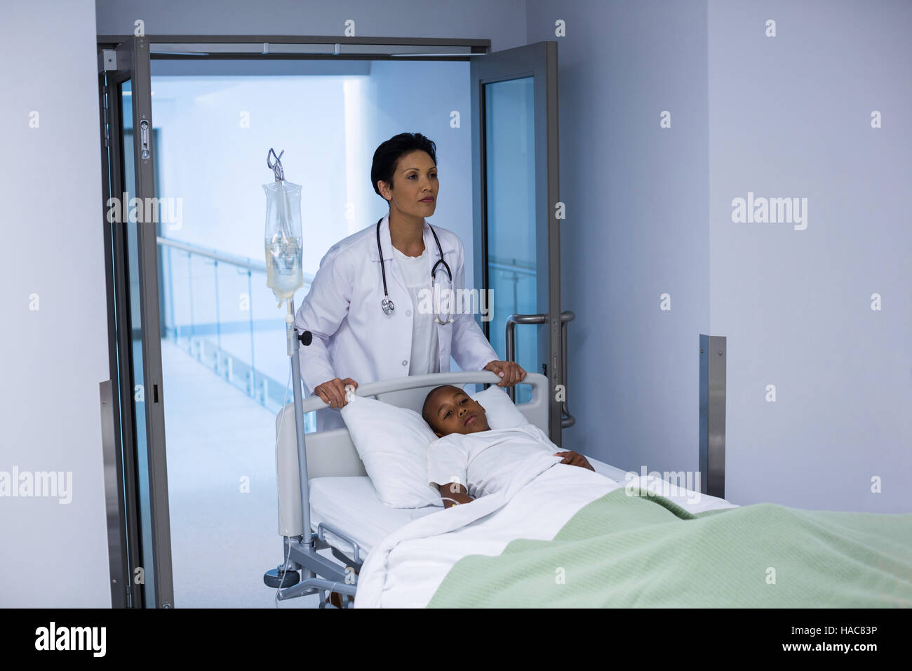 Doctor pushing emergency stretcher bed in corridor Stock Photo - Alamy