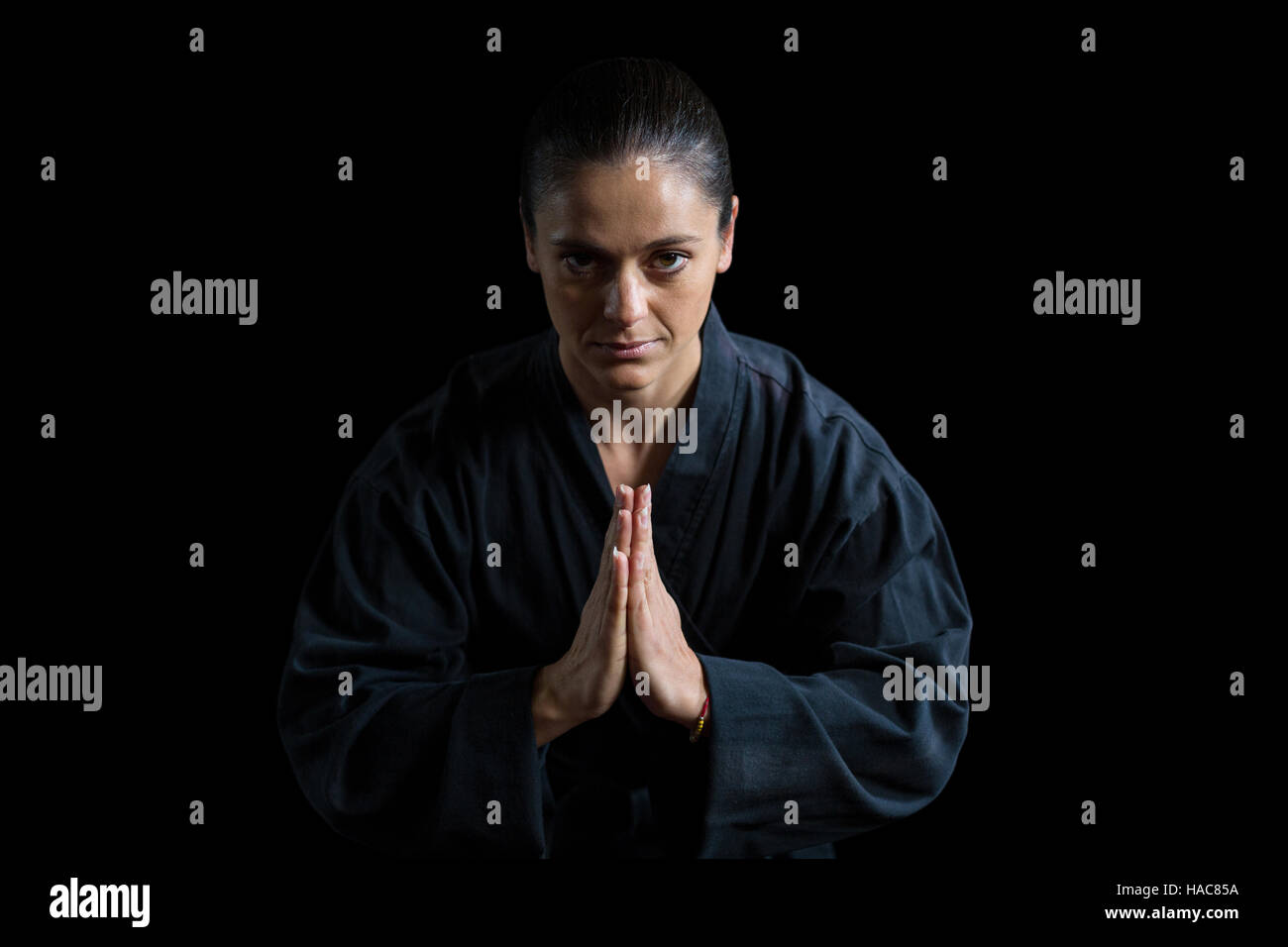 Female karate player in prayer pose Stock Photo - Alamy