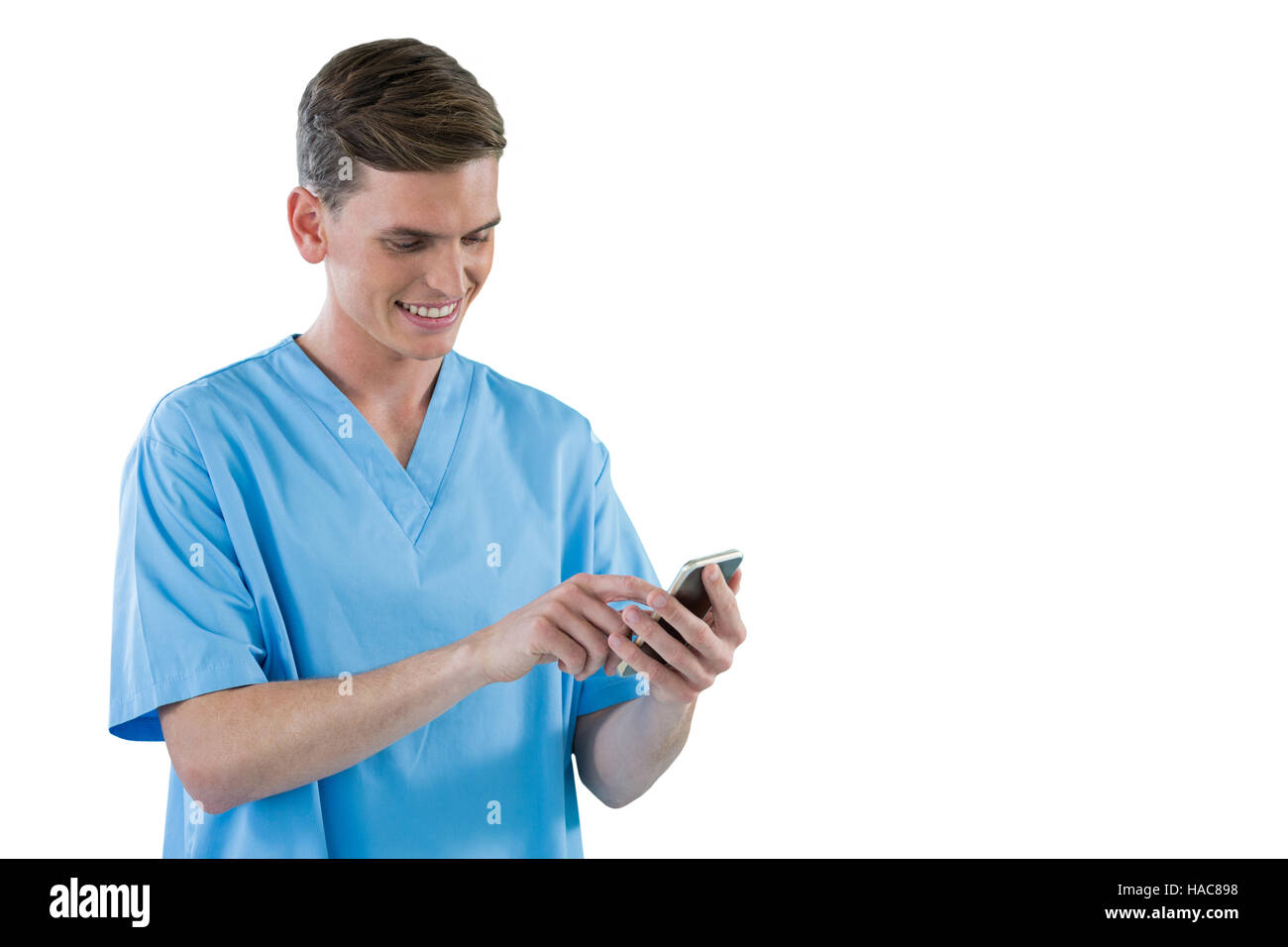 Smiling male nurse using mobile phone Stock Photo - Alamy
