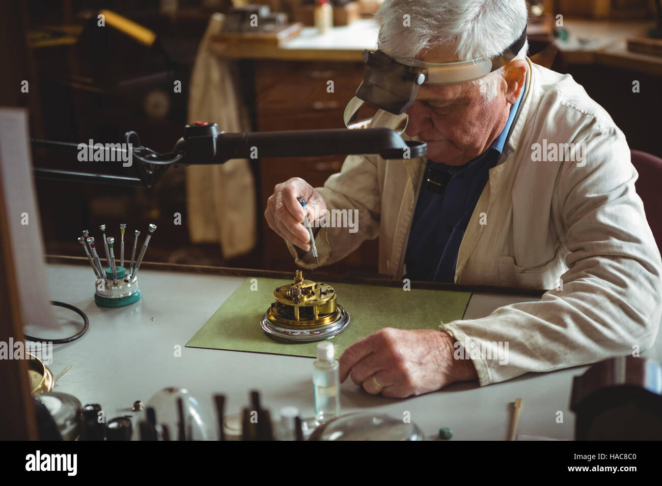 Horologist repairing a watch Stock Photo - Alamy
