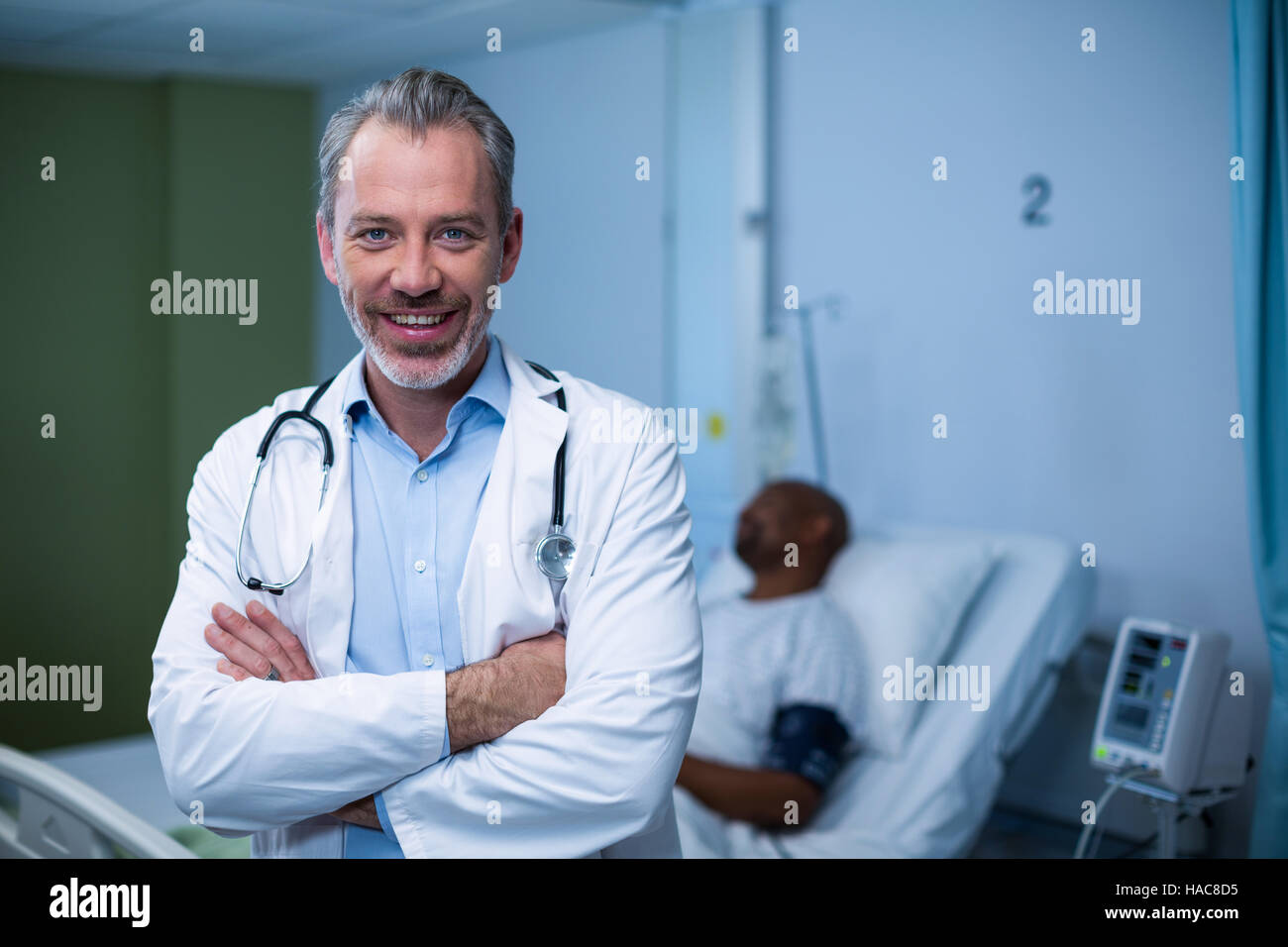 Portrait of doctor standing in ward Stock Photo - Alamy