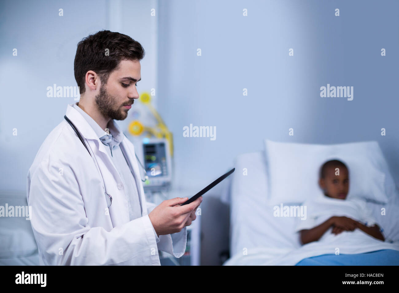 Doctor using digital tablet Stock Photo - Alamy