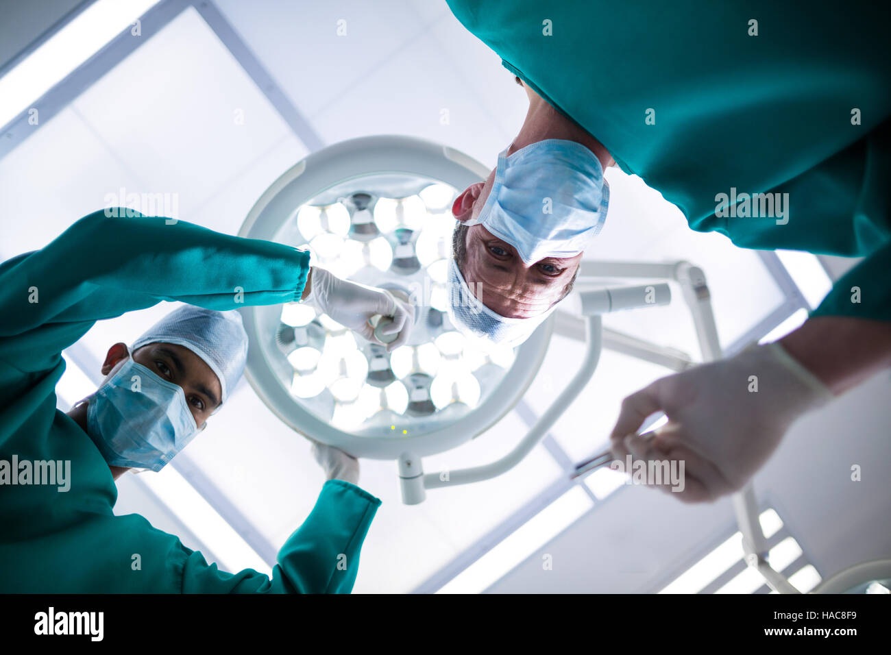 Surgeon adjusting his surgical gloves hi-res stock photography and ...