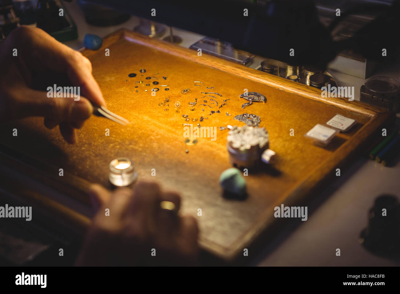 Horologist repairing a watch Stock Photo - Alamy