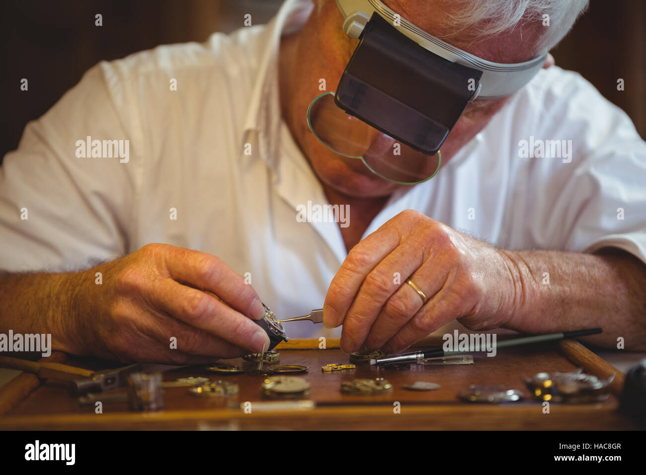 Horologist repairing a watch Stock Photo - Alamy