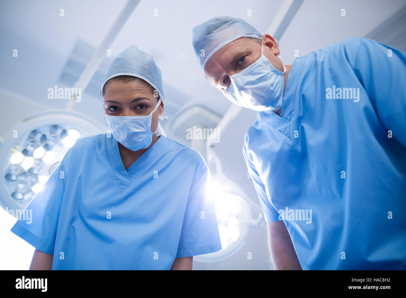 Portrait of surgeons in operation room Stock Photo - Alamy