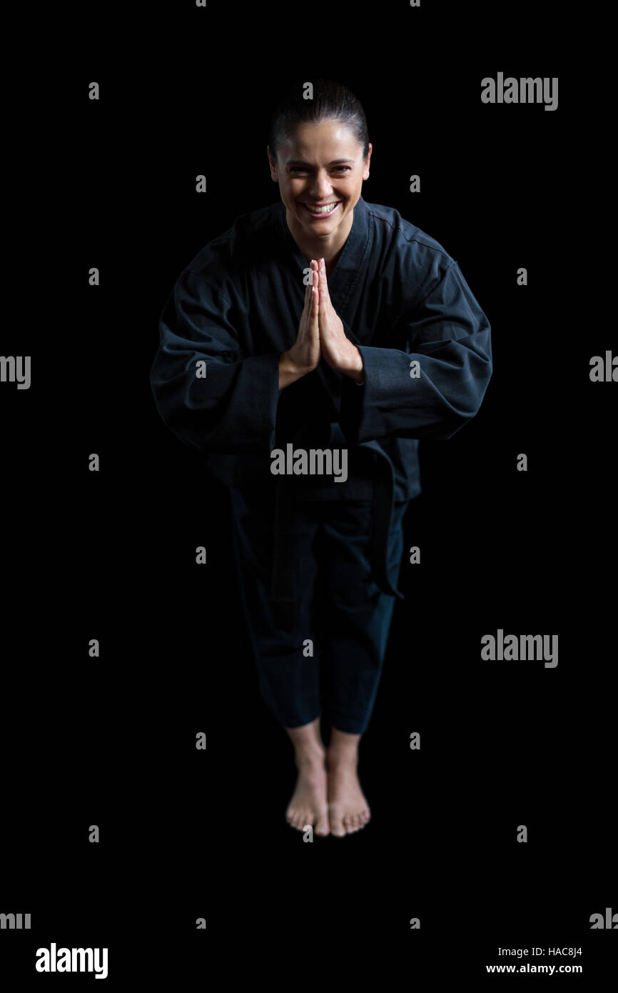 Female karate player in prayer pose Stock Photo - Alamy