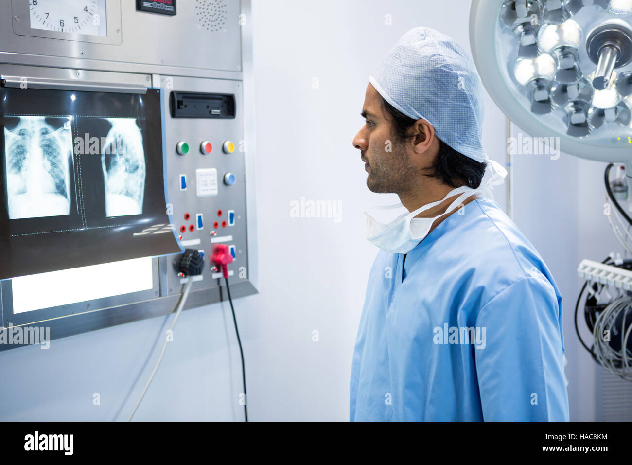Male surgeon reading x-ray in operation theater Stock Photo - Alamy