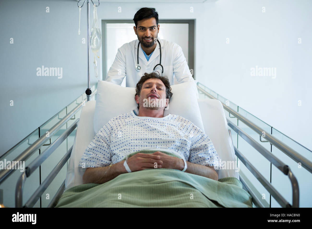 Doctor pushing emergency stretcher bed in corridor Stock Photo - Alamy