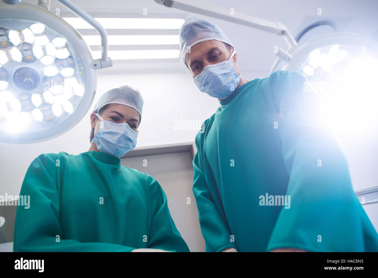 Surgeons performing operation in operation room Stock Photo - Alamy