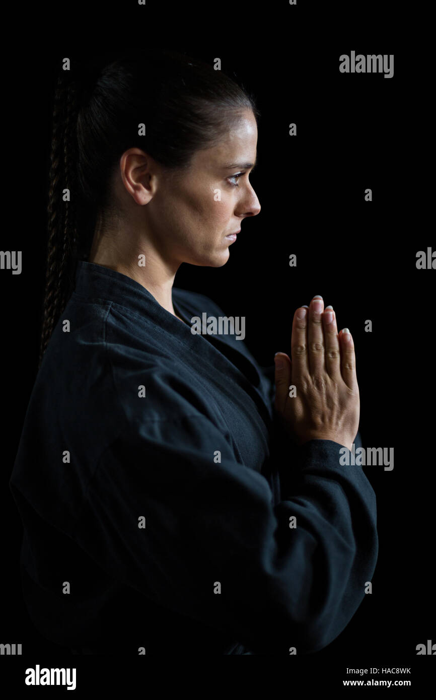Female karate player in prayer pose Stock Photo - Alamy