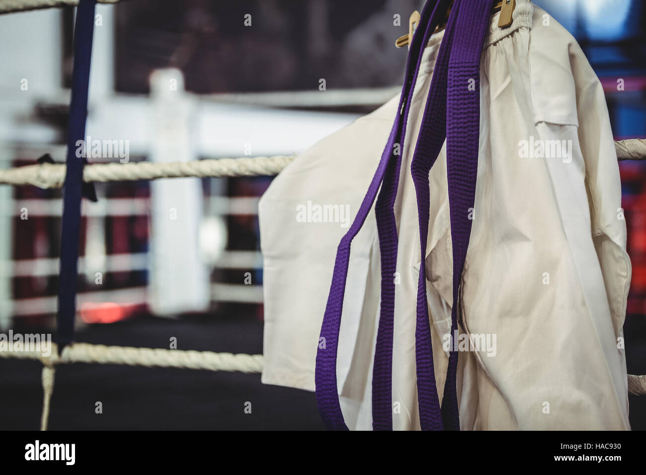 Karate uniform and purple belt in boxing ring Stock Photo - Alamy