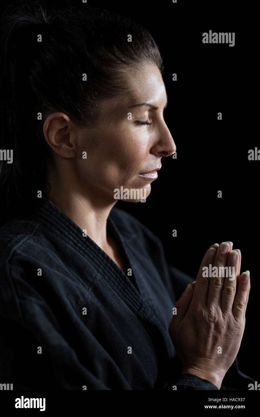 Female karate player in prayer pose Stock Photo - Alamy