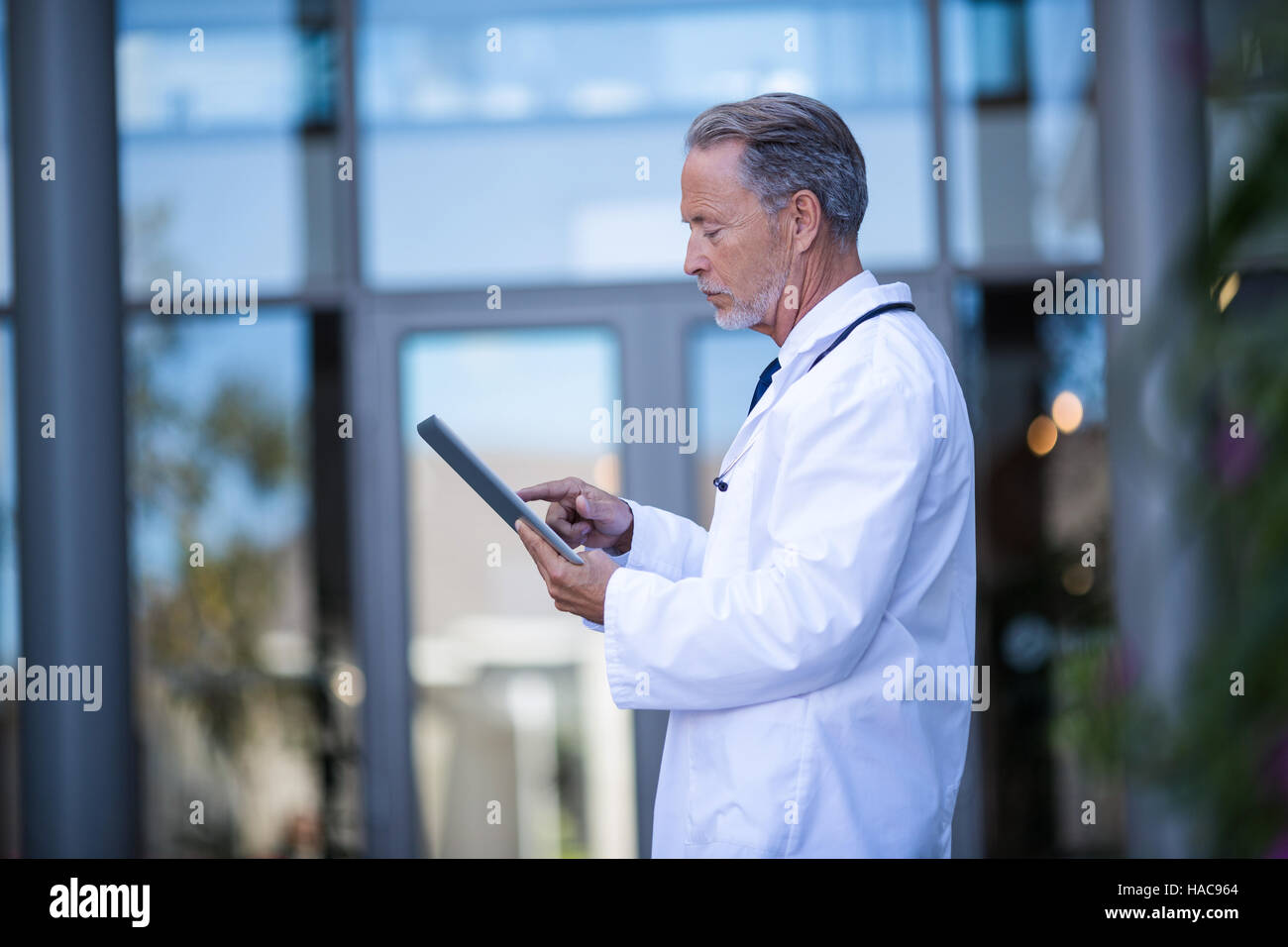 Doctor using digital tablet Stock Photo - Alamy