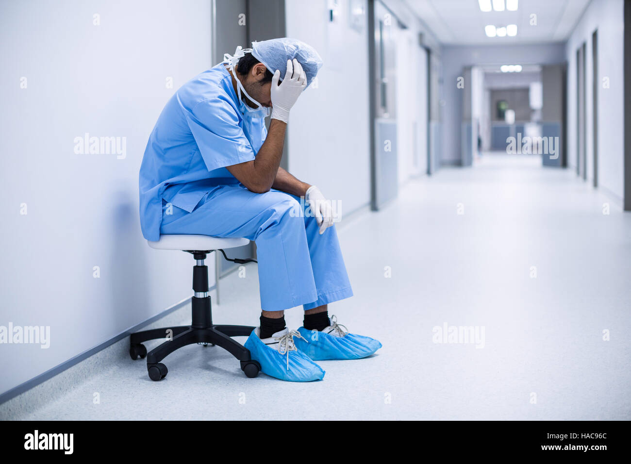 Sad surgeon sitting on a chair Stock Photo - Alamy Sad surgeon sitting on a chair Stock Photo - Alamy