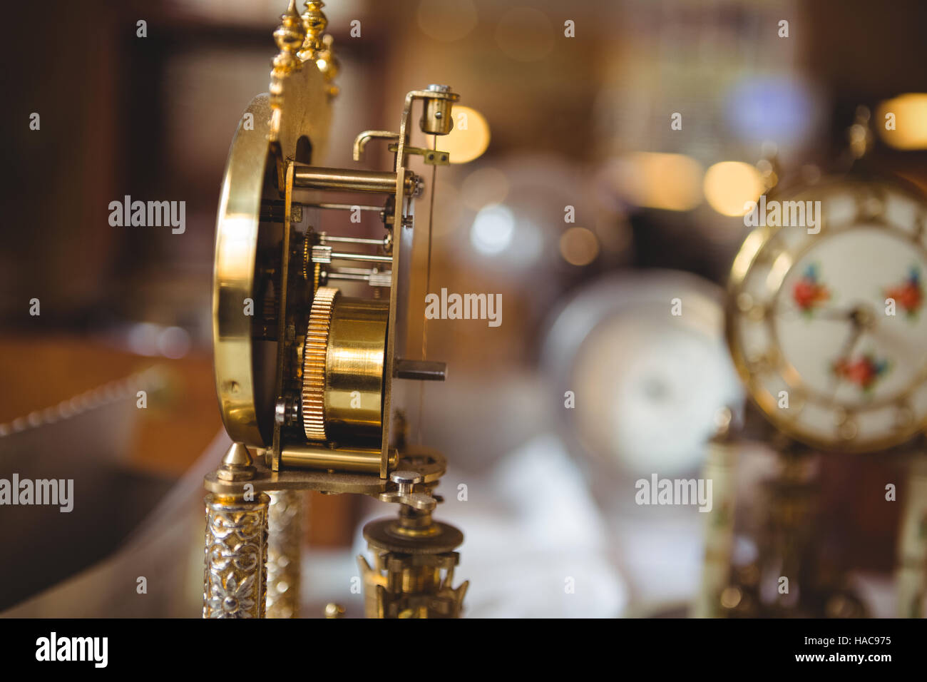Close-up of golden watch on table Stock Photo - Alamy