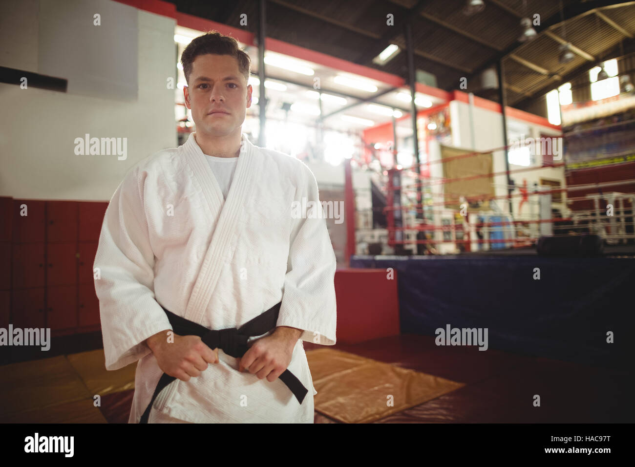 Karate player standing in fitness studio Stock Photo - Alamy