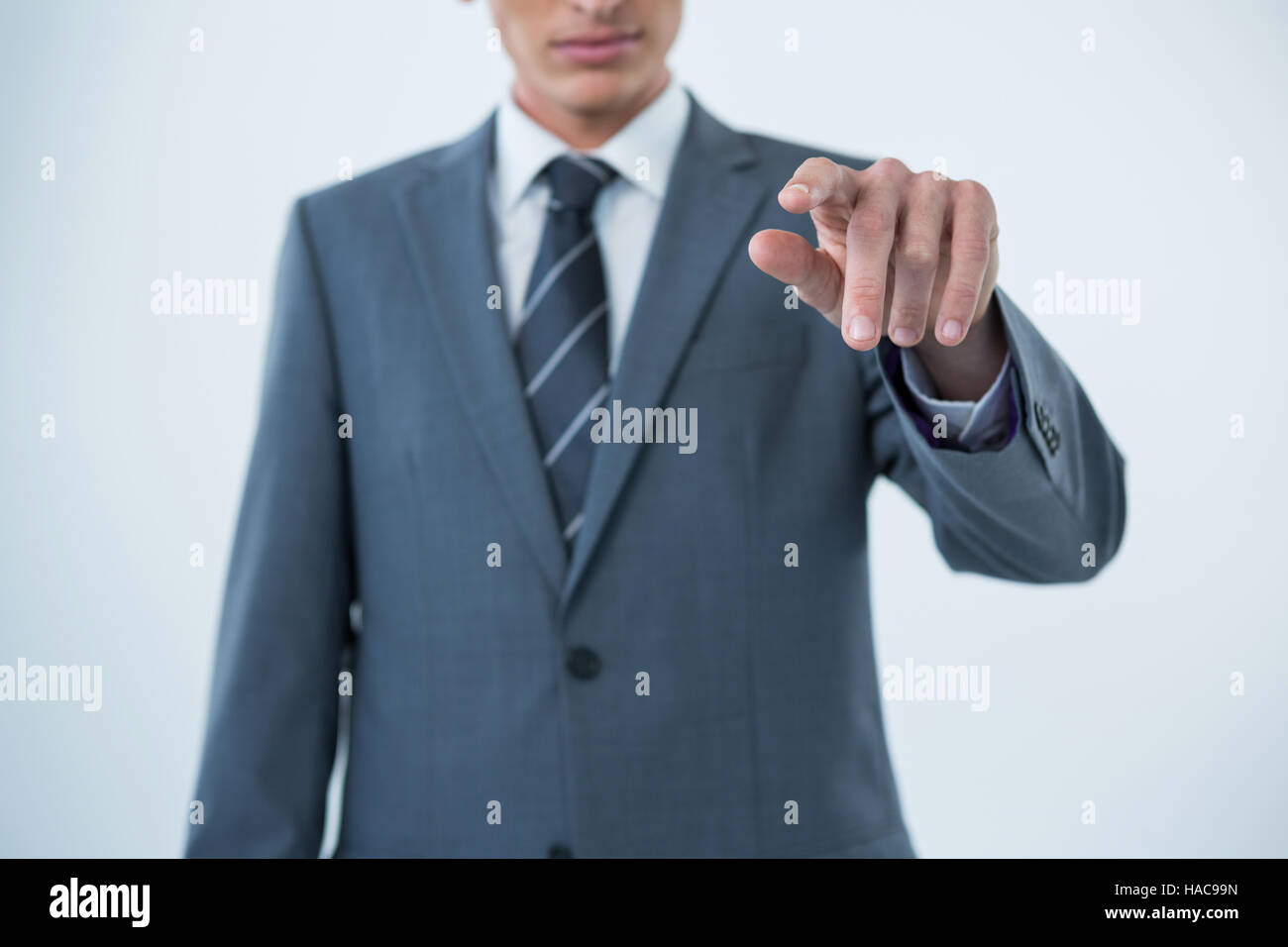 Businessman making hand gesture Stock Photo - Alamy