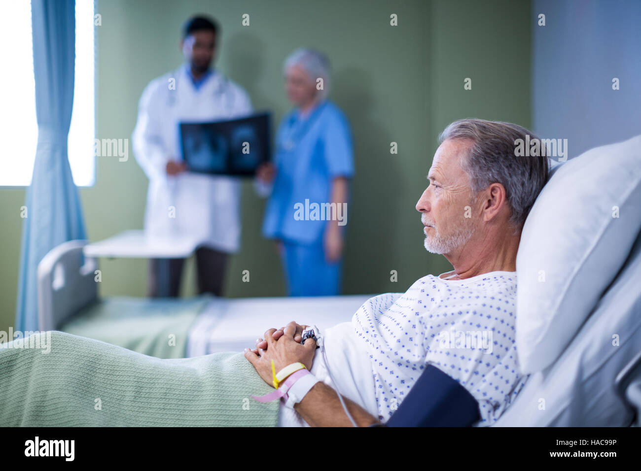 Sick patient lying on bed Stock Photo - Alamy
