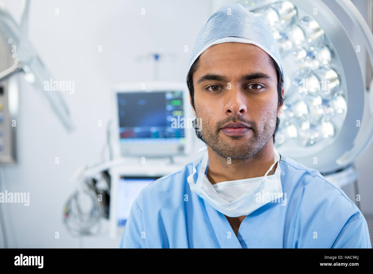 Portrait of male surgeon standing in operation theater Stock Photo - Alamy