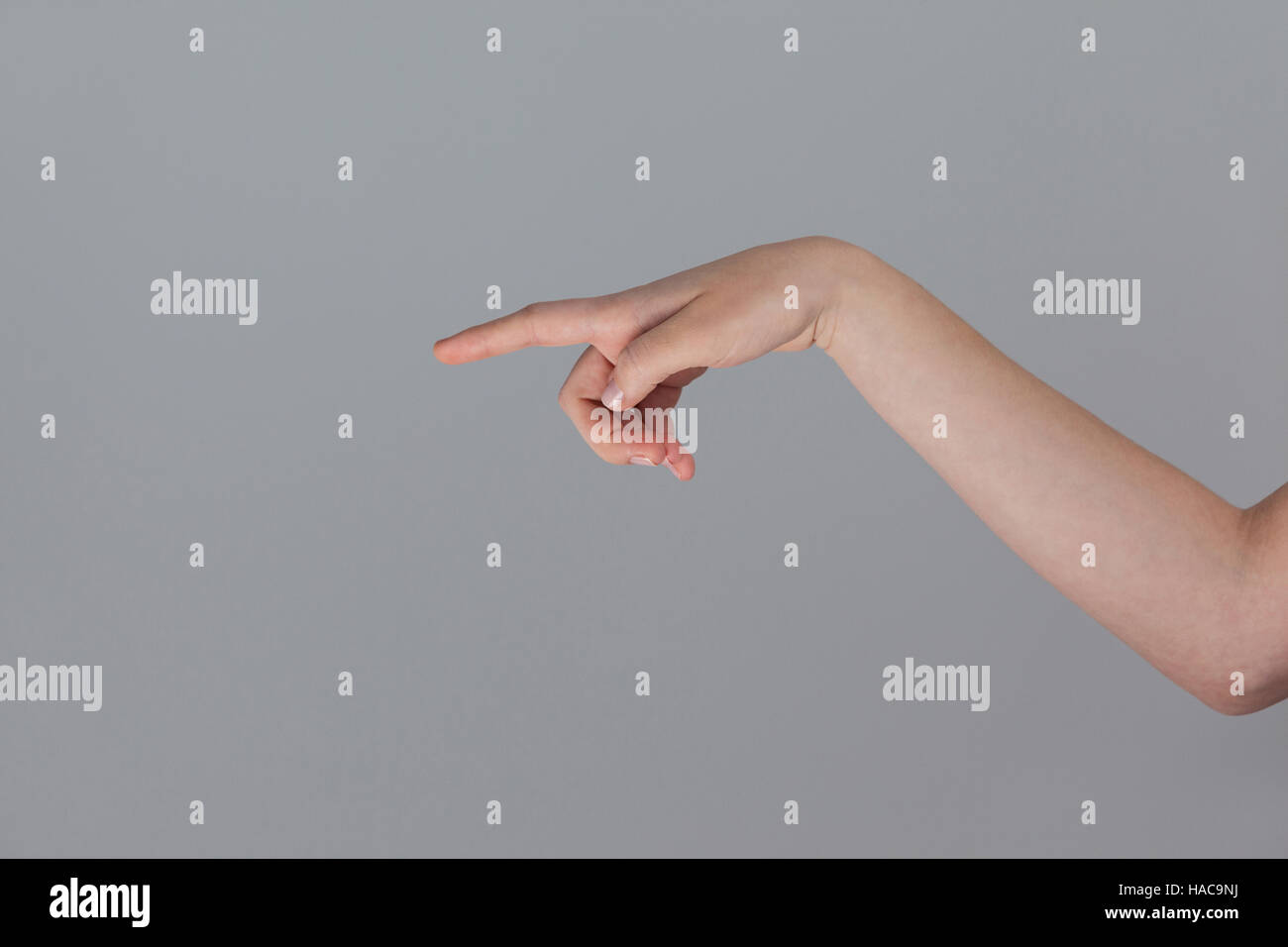 Hand of a woman pointing sideways Stock Photo - Alamy