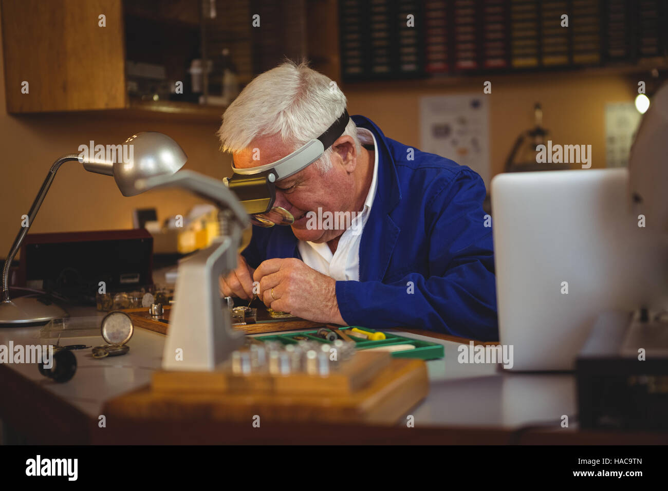 Horologist repairing a watch Stock Photo - Alamy