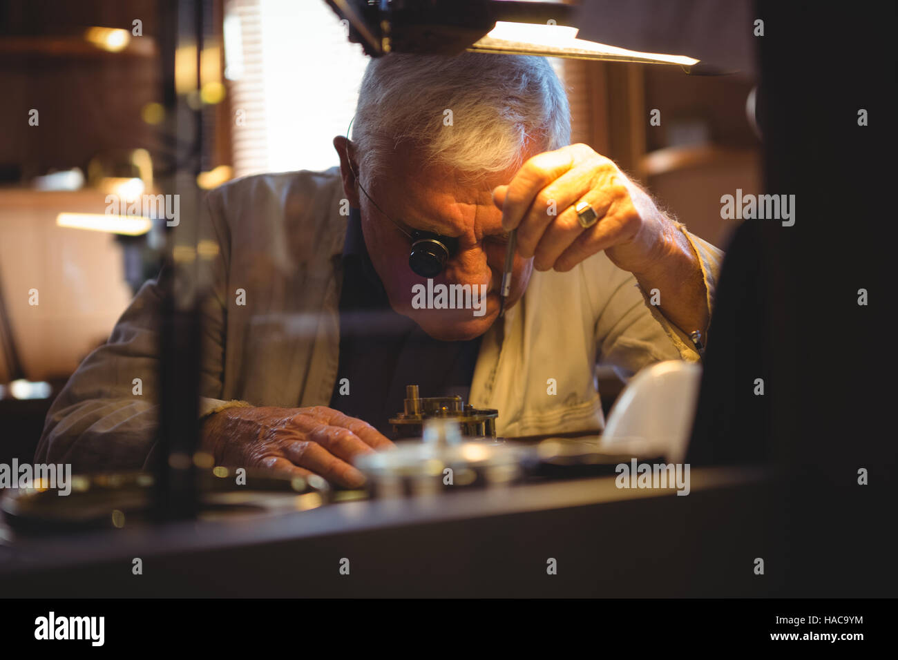 Horologist repairing a watch Stock Photo - Alamy