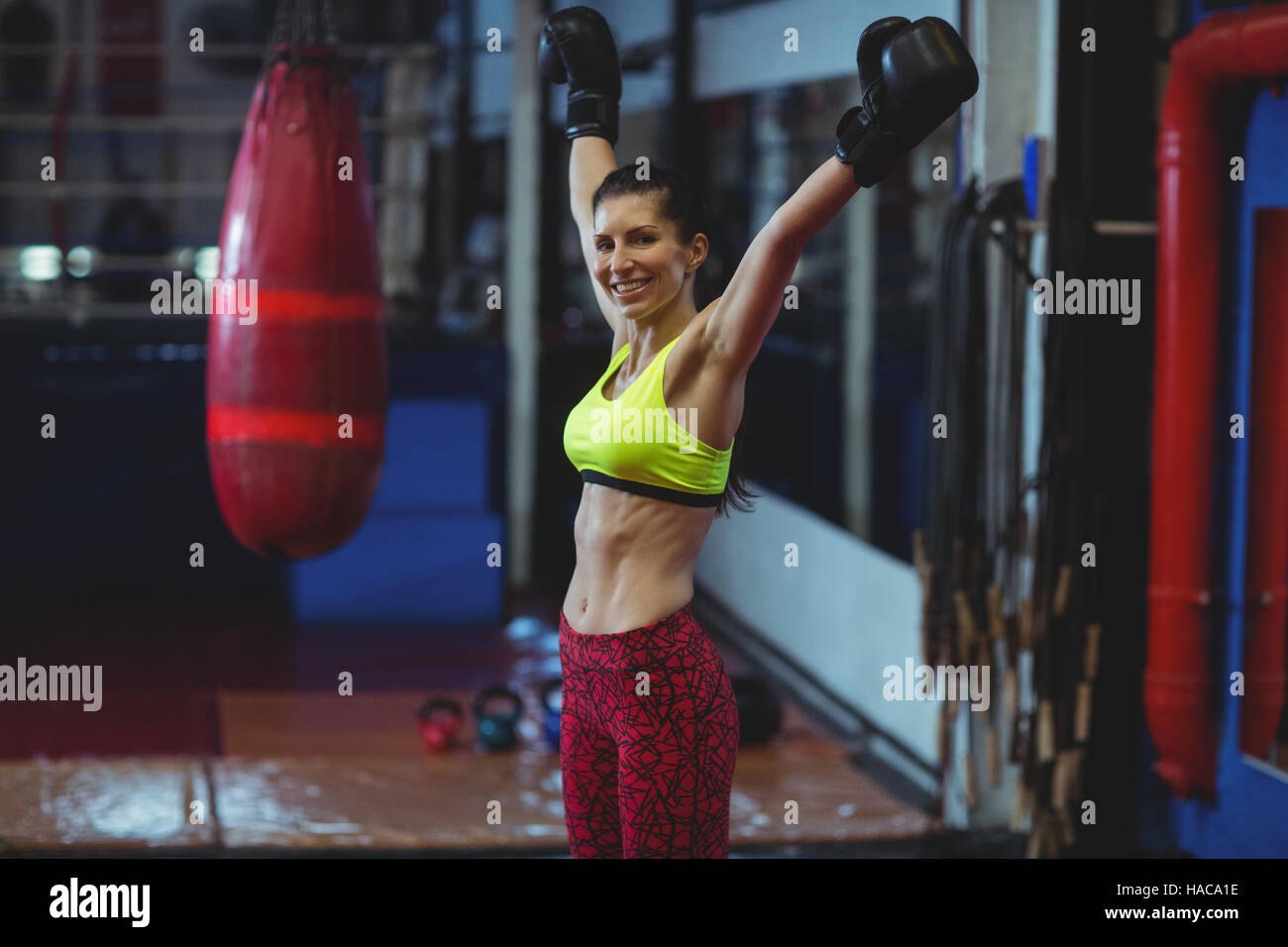 Excited female boxer posing after victory Stock Photo - Alamy