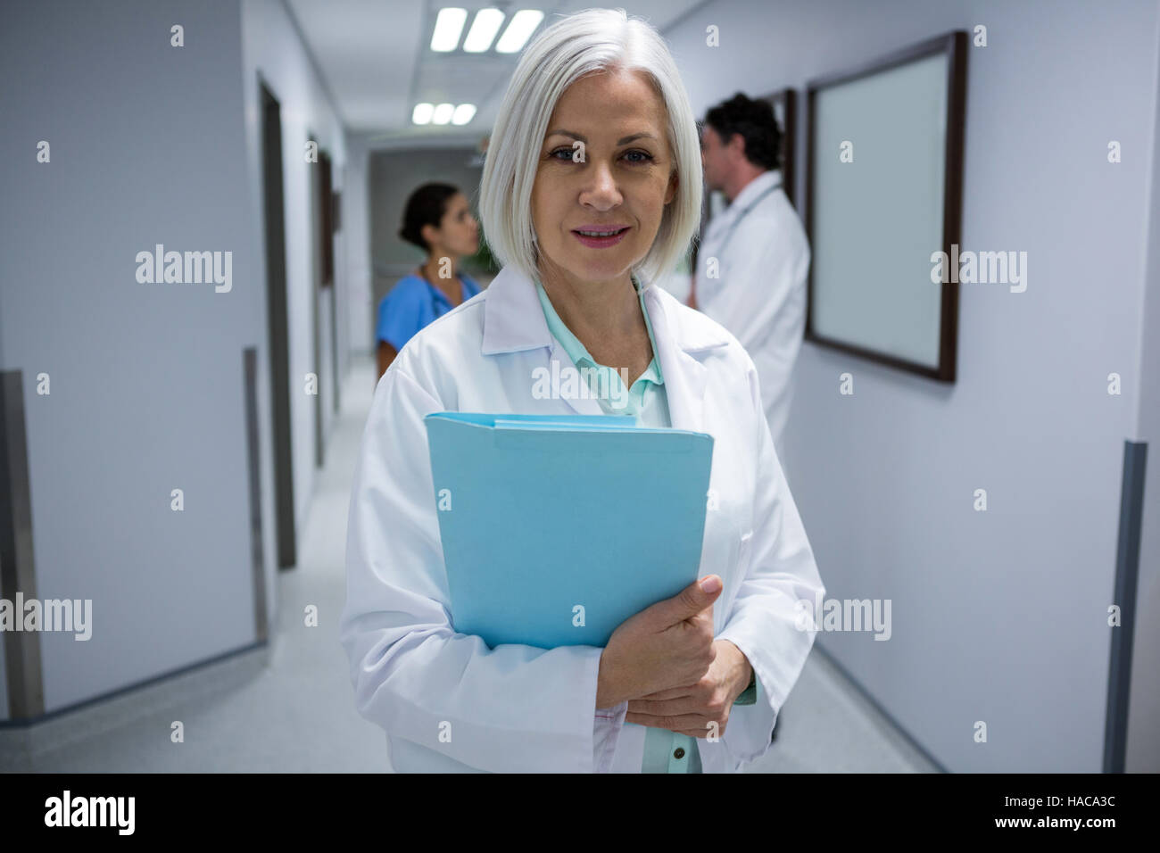 Portrait doctor holding file hi-res stock photography and images - Alamy