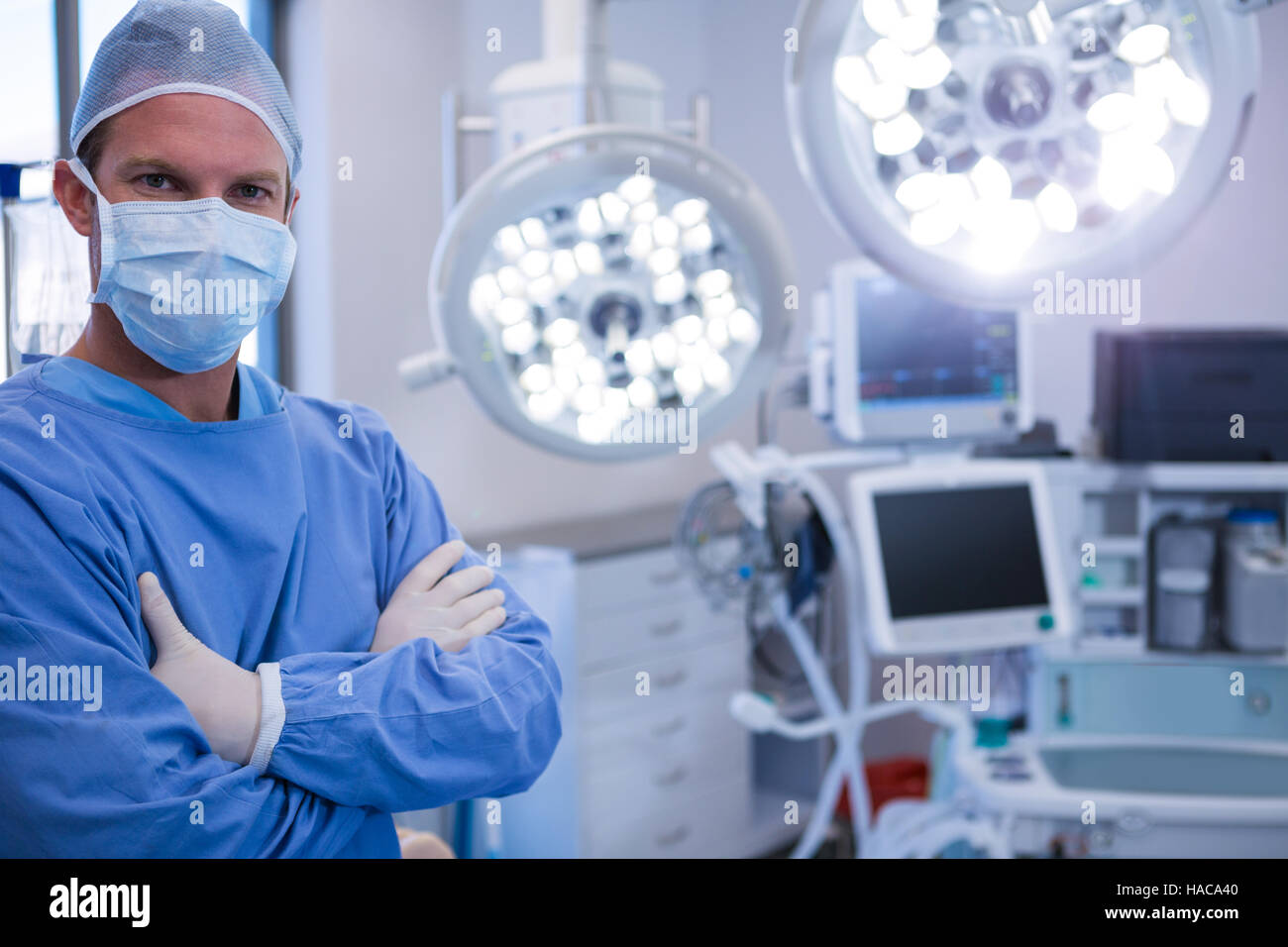 Portrait of male surgeon standing in operation theater Stock Photo - Alamy