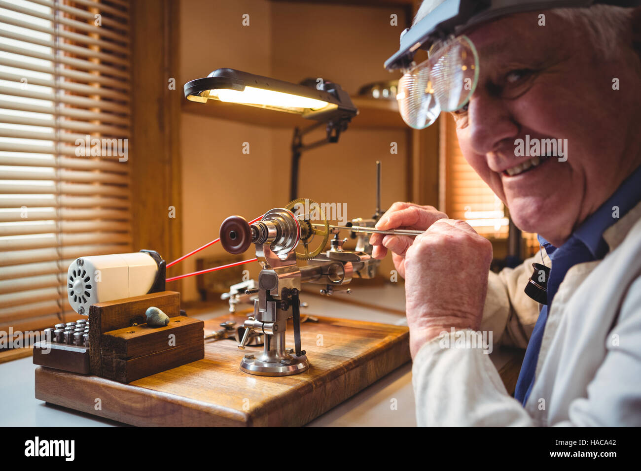 Horologist repairing a watch in the workshop Stock Photo - Alamy