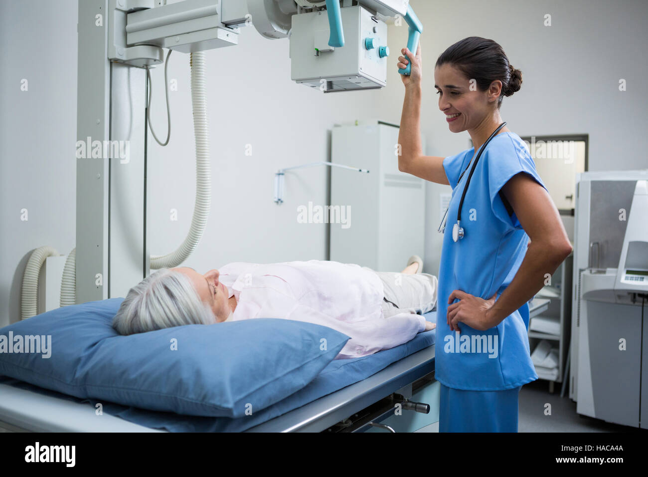 Doctor performing a x-ray test on patient chest Stock Photo - Alamy
