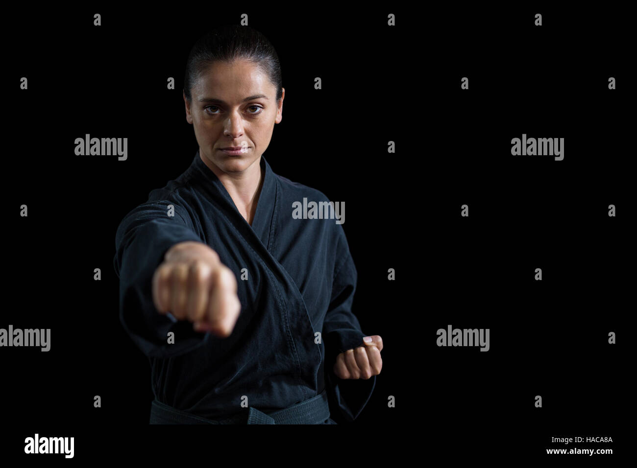 Female karate player performing karate stance Stock Photo - Alamy