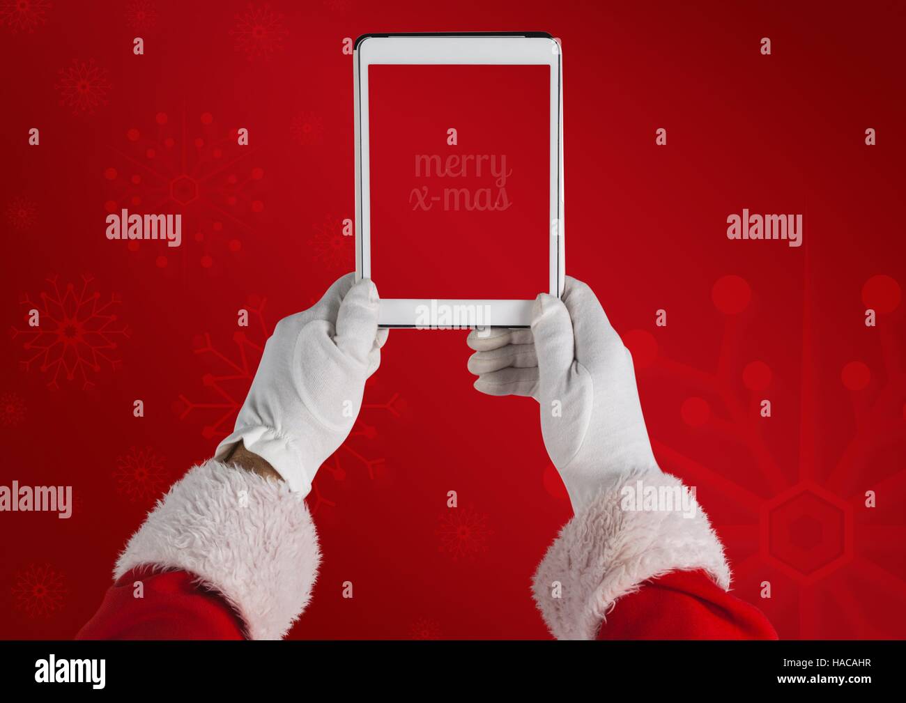 Hands of santa claus holding a digital tablet Stock Photo - Alamy