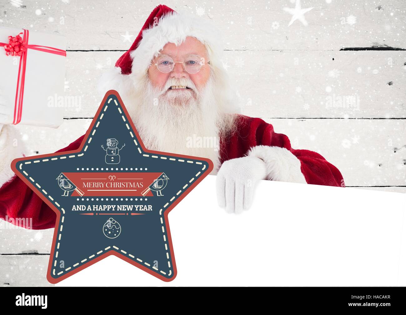 Santa claus holding placard with merry christmas greetings Stock Photo ...