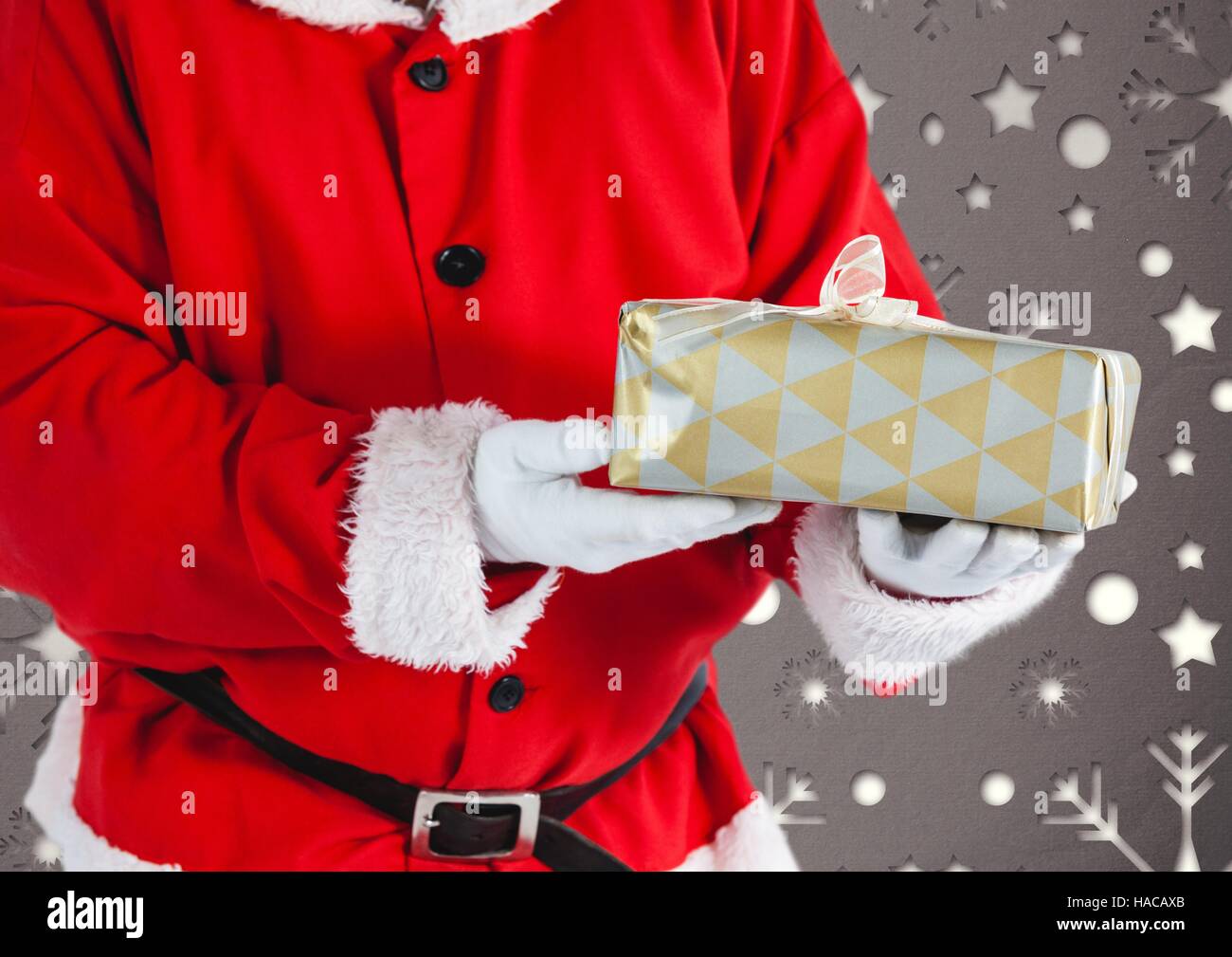 Santa claus holding christmas gift Stock Photo - Alamy