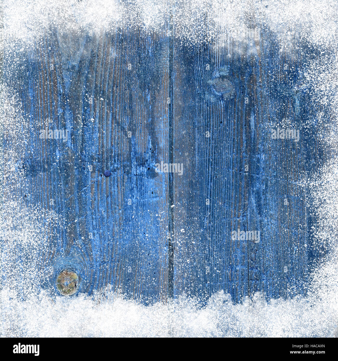 Winter background with snowfall on the old wooden barn wall and ...