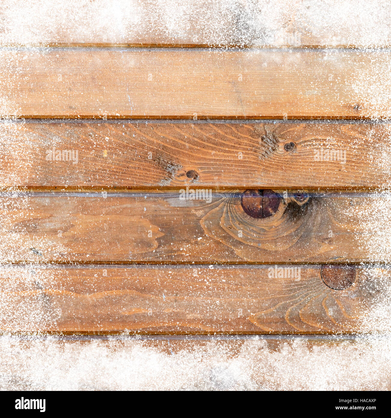 Winter background with snowfall on the old wooden barn wall and ...